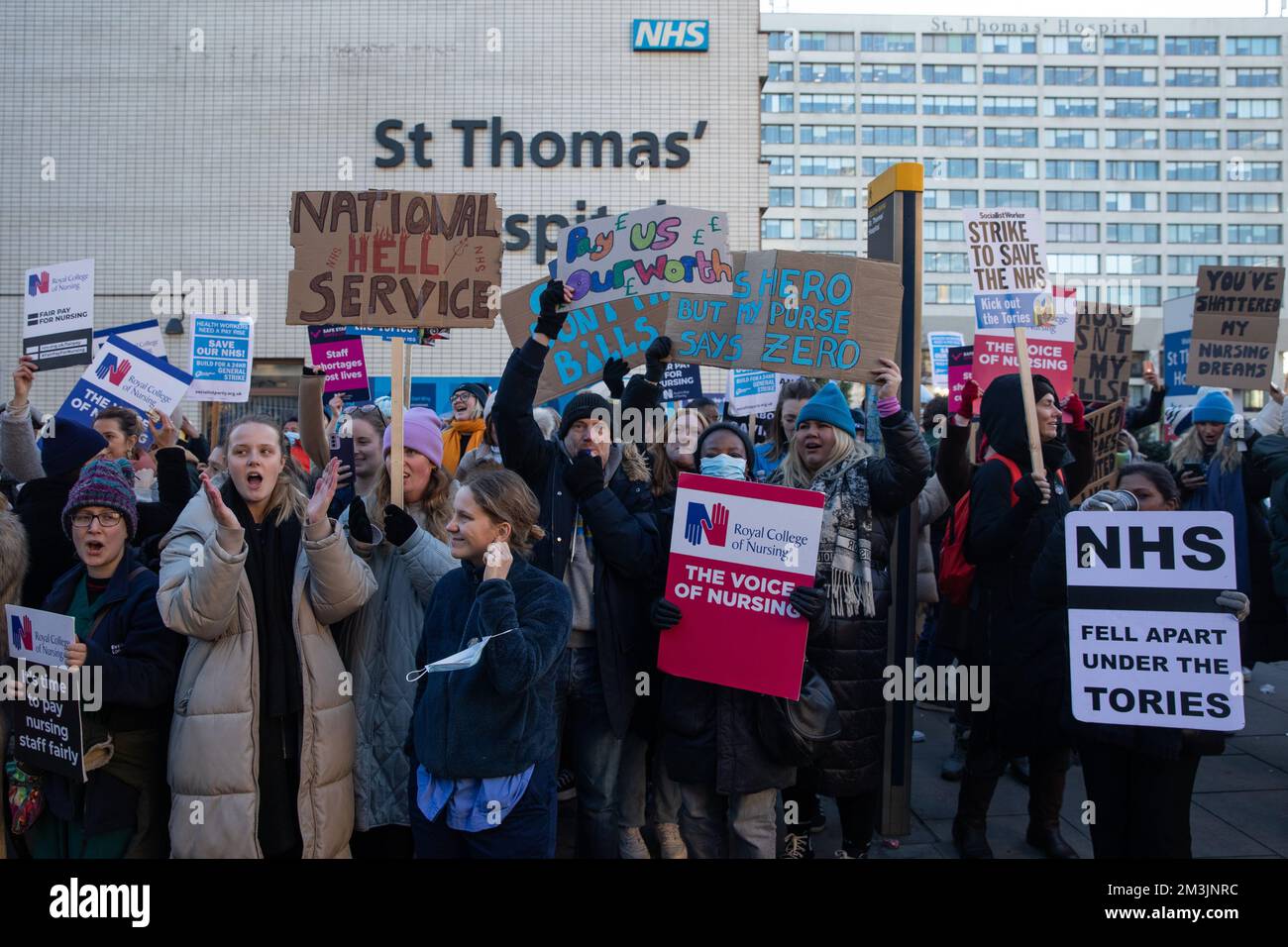 London, UK. 15th December, 2022. Nurses hold placards and signs at an ...