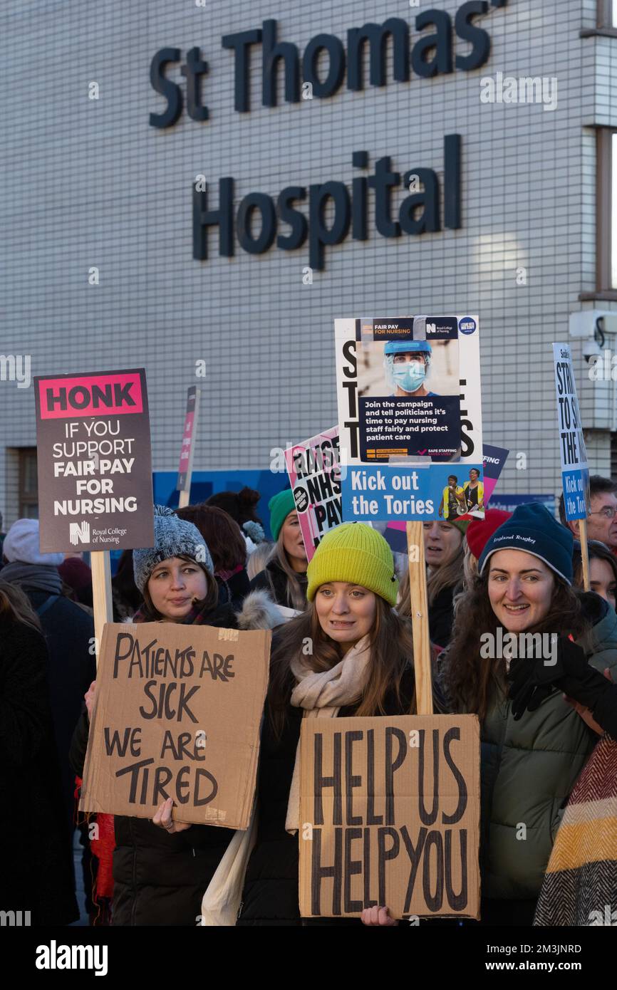 London, UK. 15th December, 2022. Nurses hold placards and signs at an ...