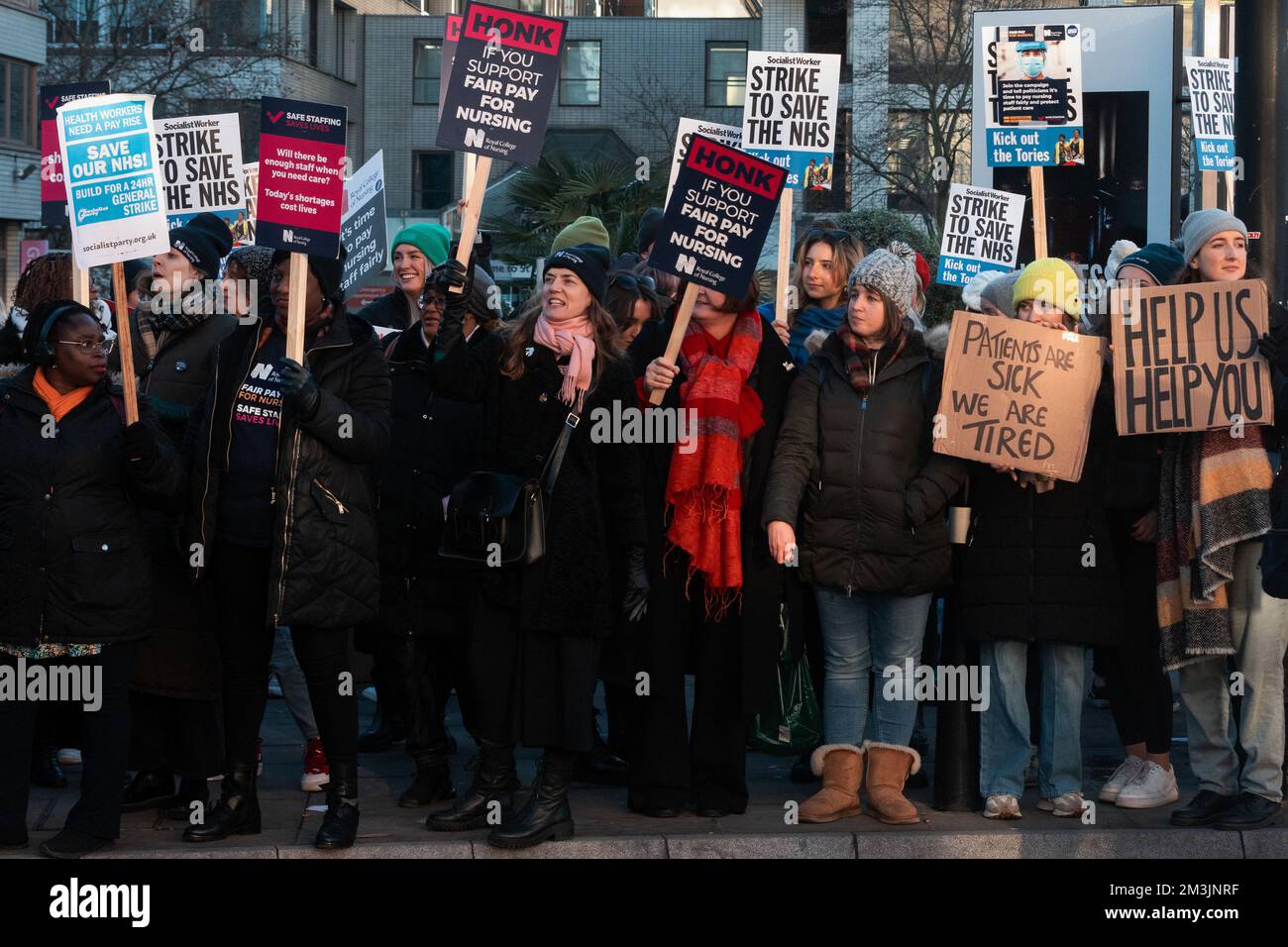 London, UK. 15th December, 2022. Nurses hold placards and signs at an ...