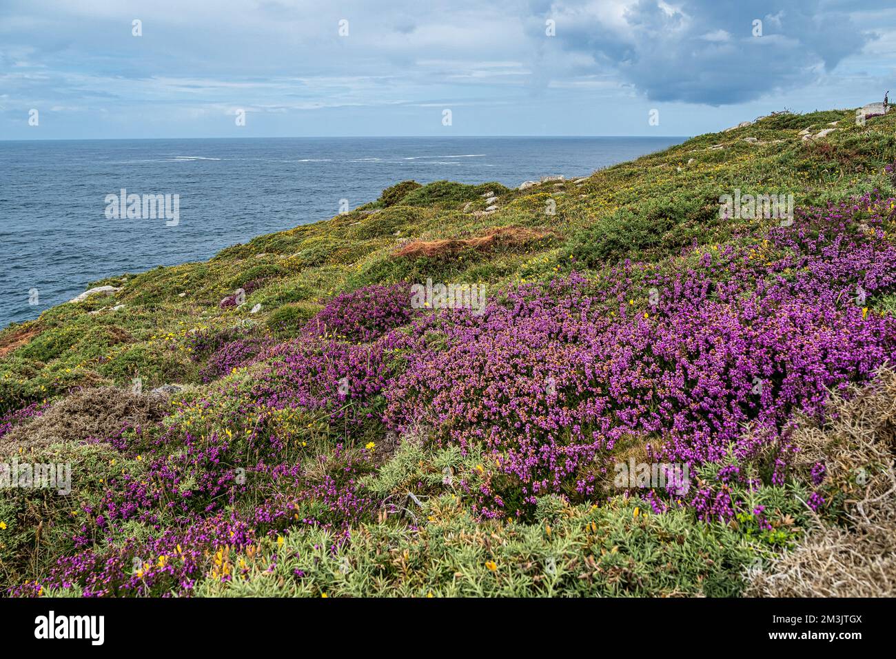 The cape of Tourinan in Muxia, Costa da Morte, Death Coast, Galicia, Spain. These cliffs are the ...
