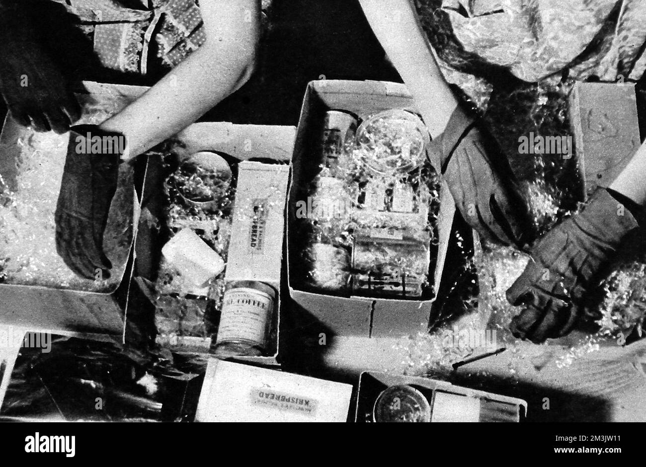 Preparing Red Cross food parcels Stock Photo - Alamy