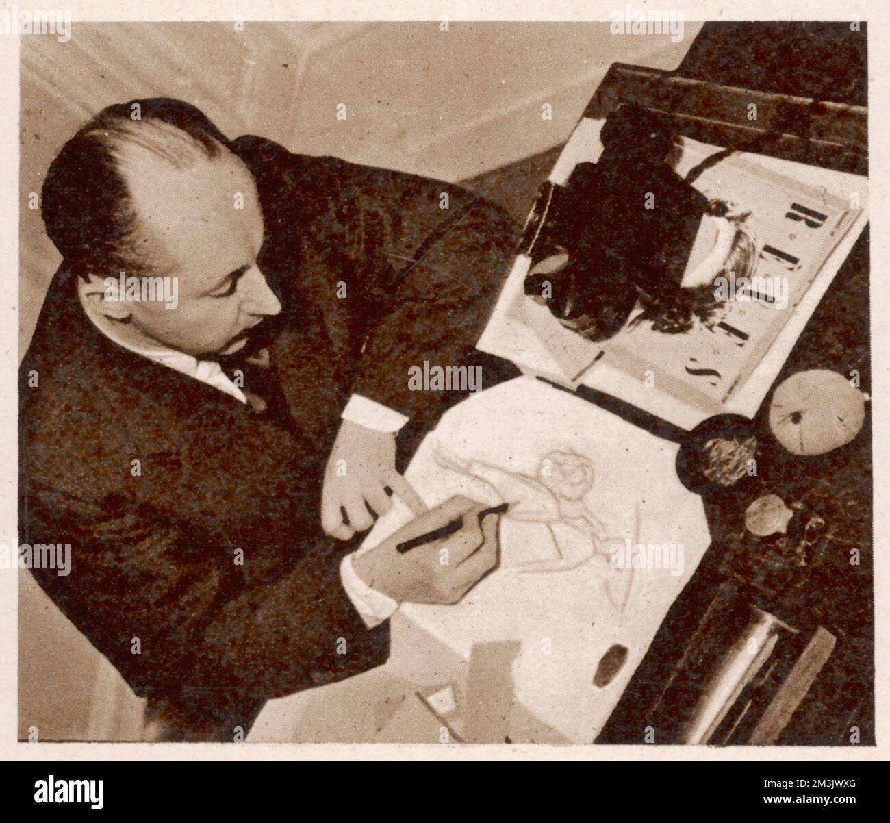 Christian Dior sketching a fashion design, 1948 Stock Photo - Alamy
