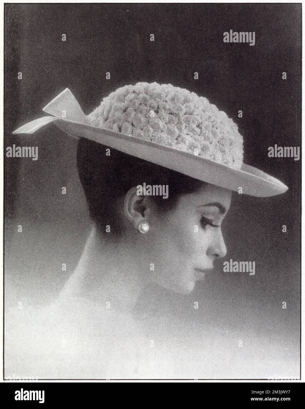 A design by Reed Crawford made of tiny pink-petalled daisies massed on ...