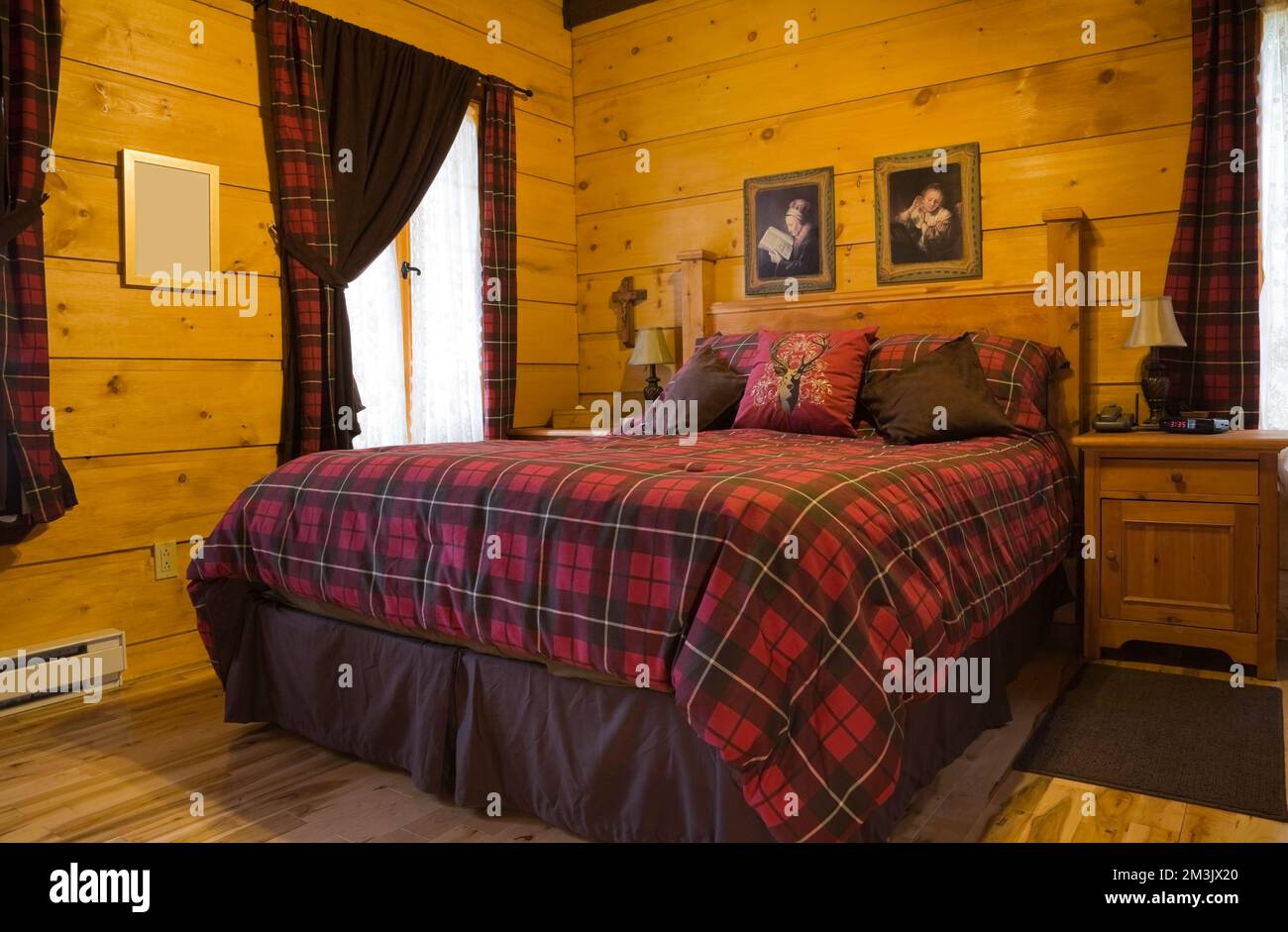 Double bed with red and brown checkered bedspread and matching window ...