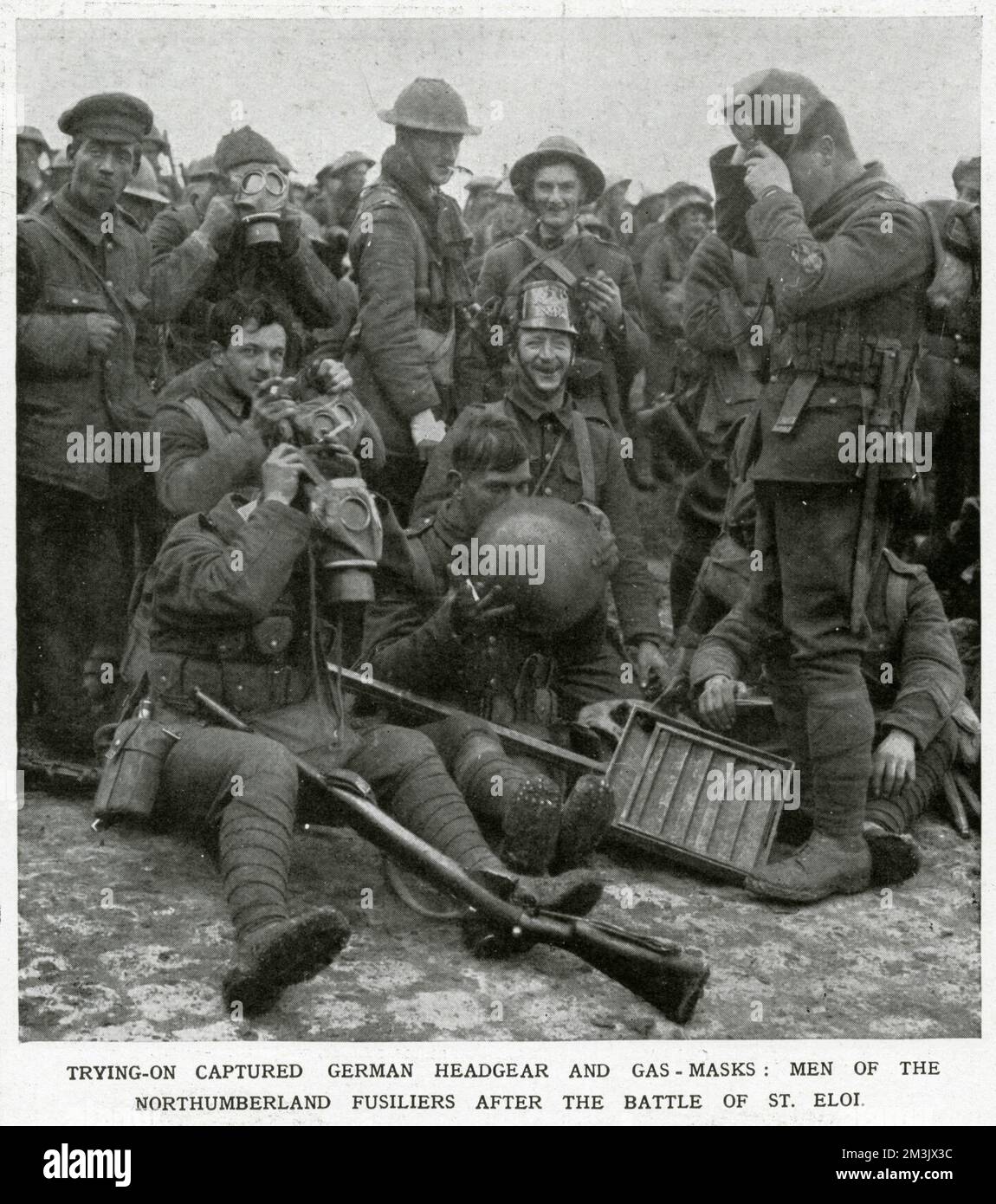 British soldiers trying on captured German headgear 1916 Stock Photo ...