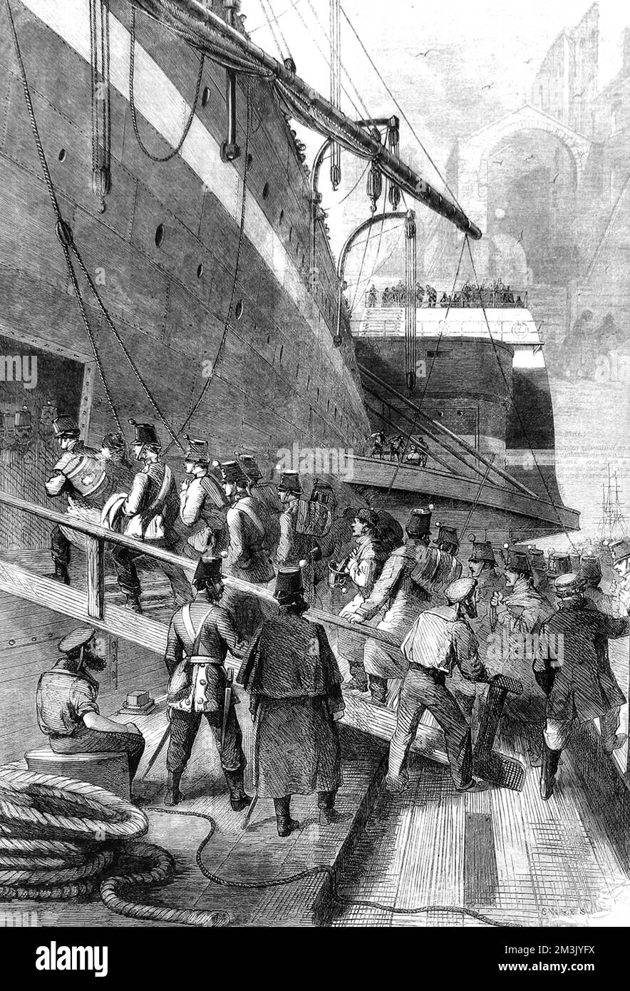 Soldiers in full uniform marching up the gangplank of the troop carrier ...