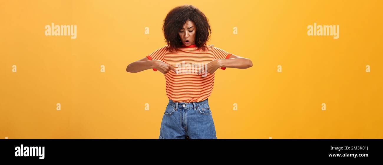 Portrait of worried questioned and surprised african american female ...