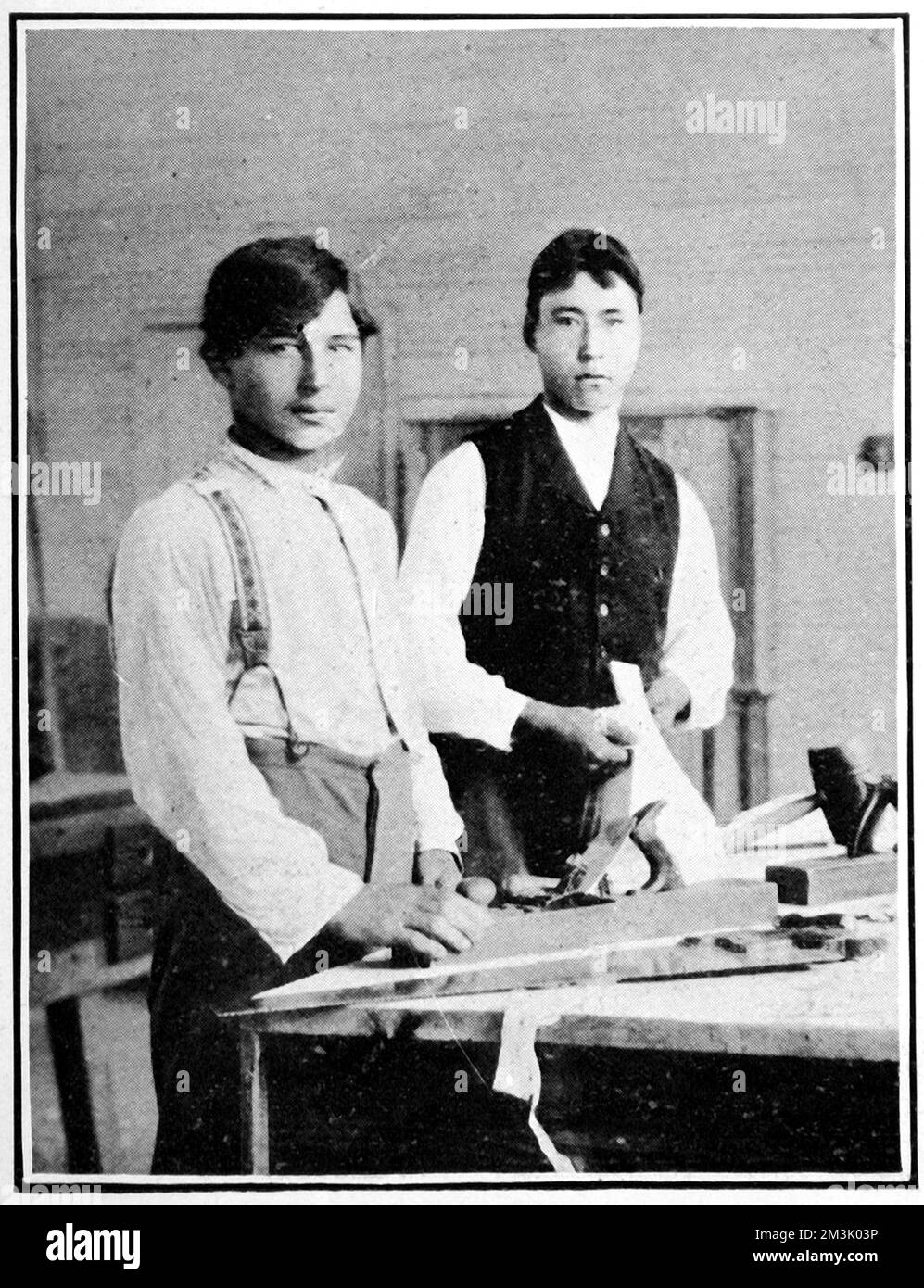 Two men using Black and White Stock Photos & Images - Alamy