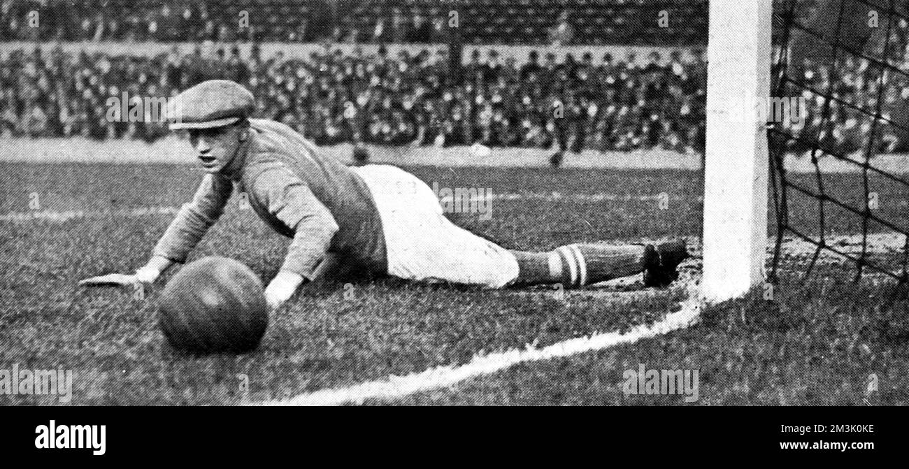 Photograph showing Johnson, the Leeds Goalkeeper, pushing a shot wide ...