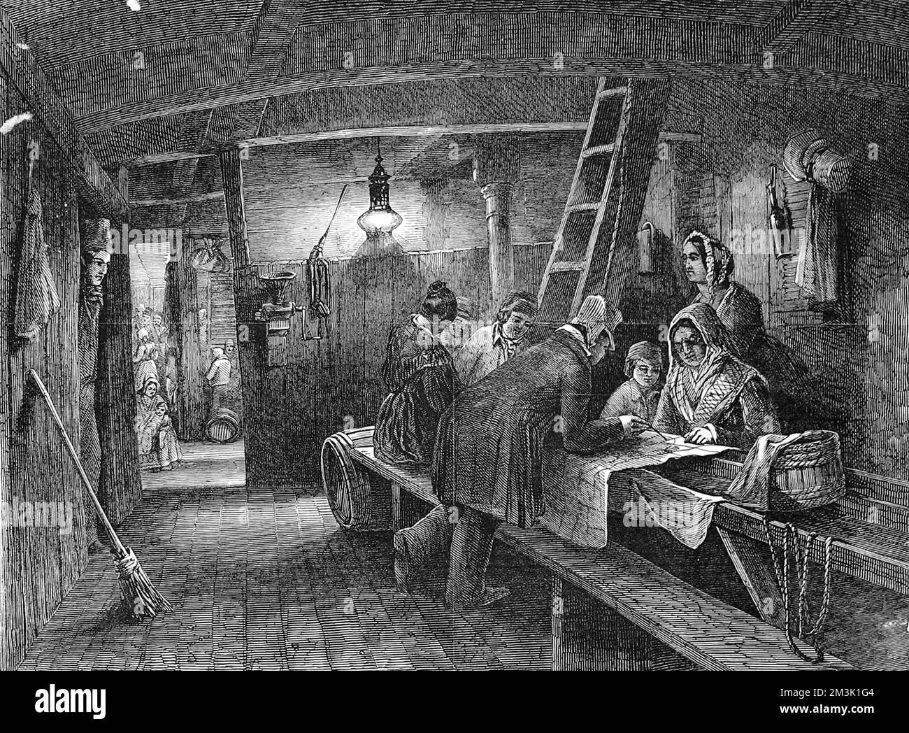 Engraving showing a family of emigrants, below decks, poring over a ...