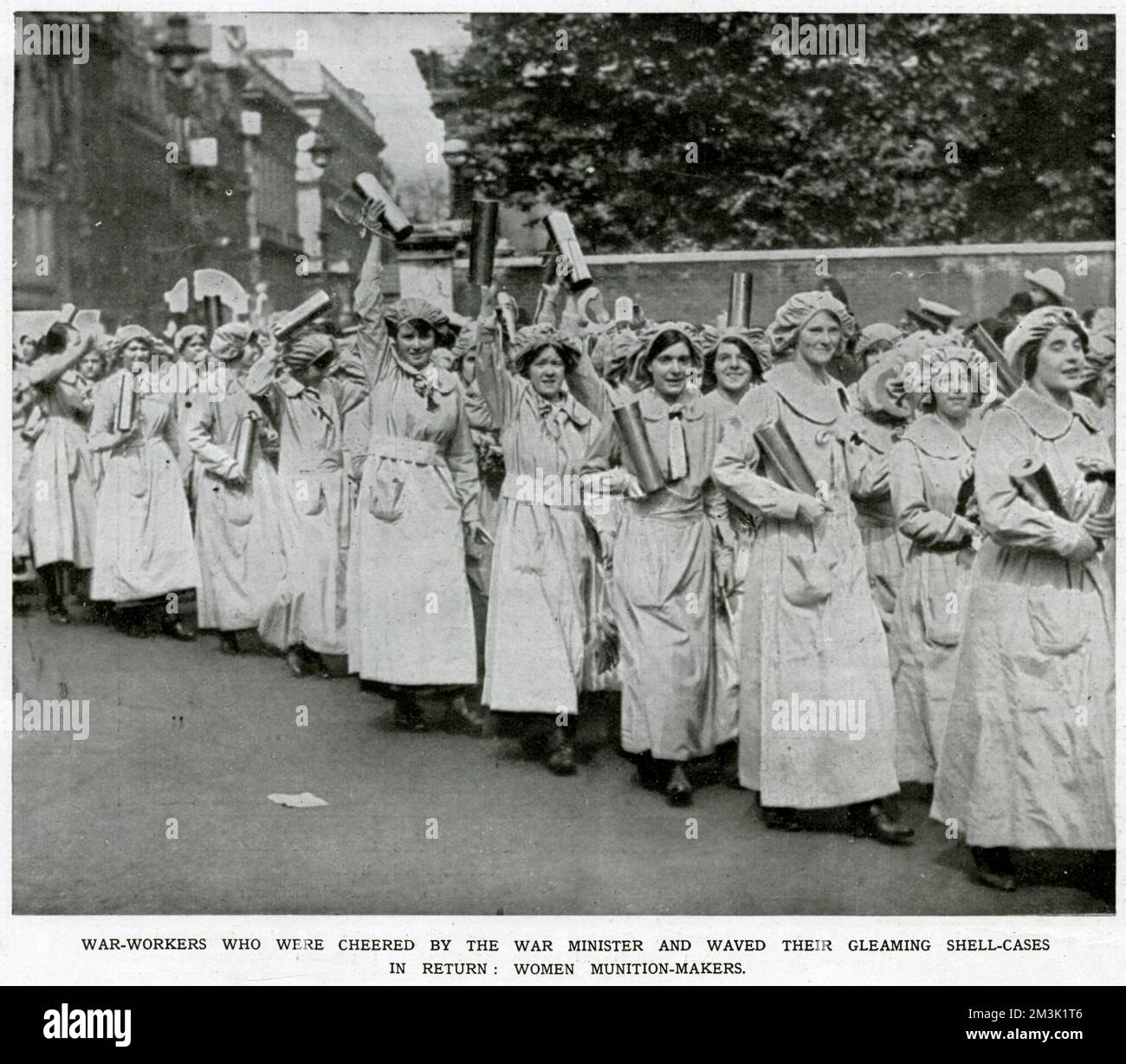 Female workers from a munitions factory are shown taking part in a ...