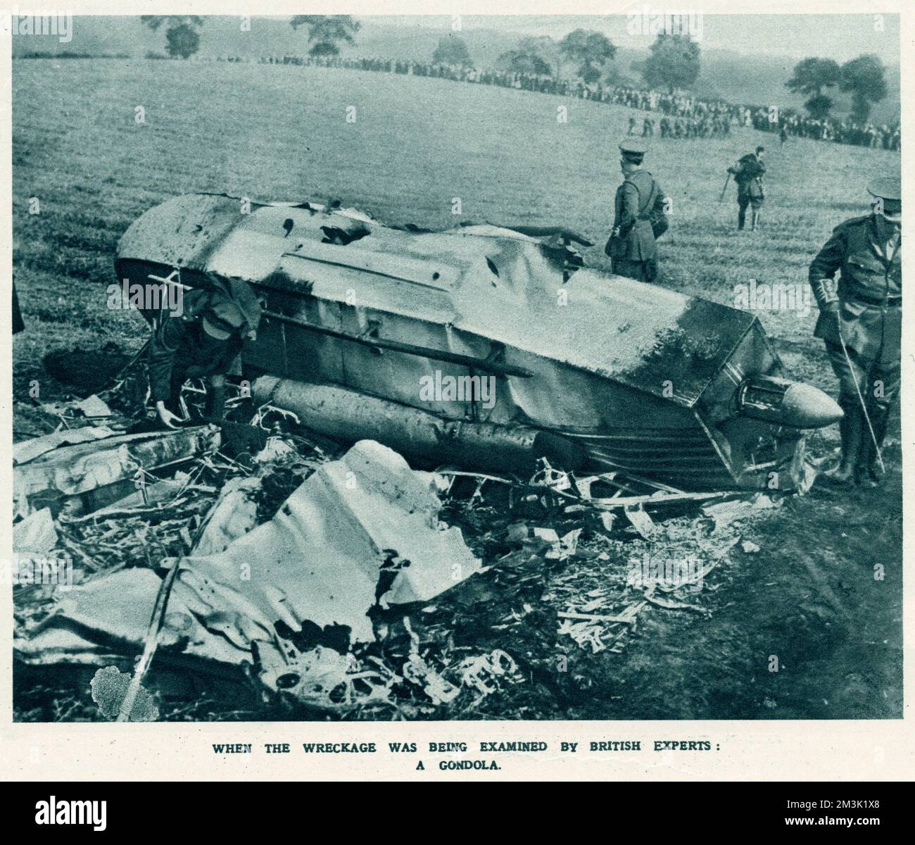 A gondola, part of a crashed zeppelin, being examined by the Stock ...