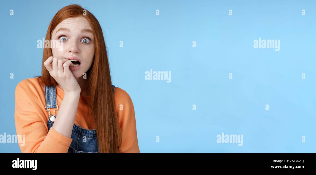 Scared unconfident anxious young trembling redhead girl wide eyes ...