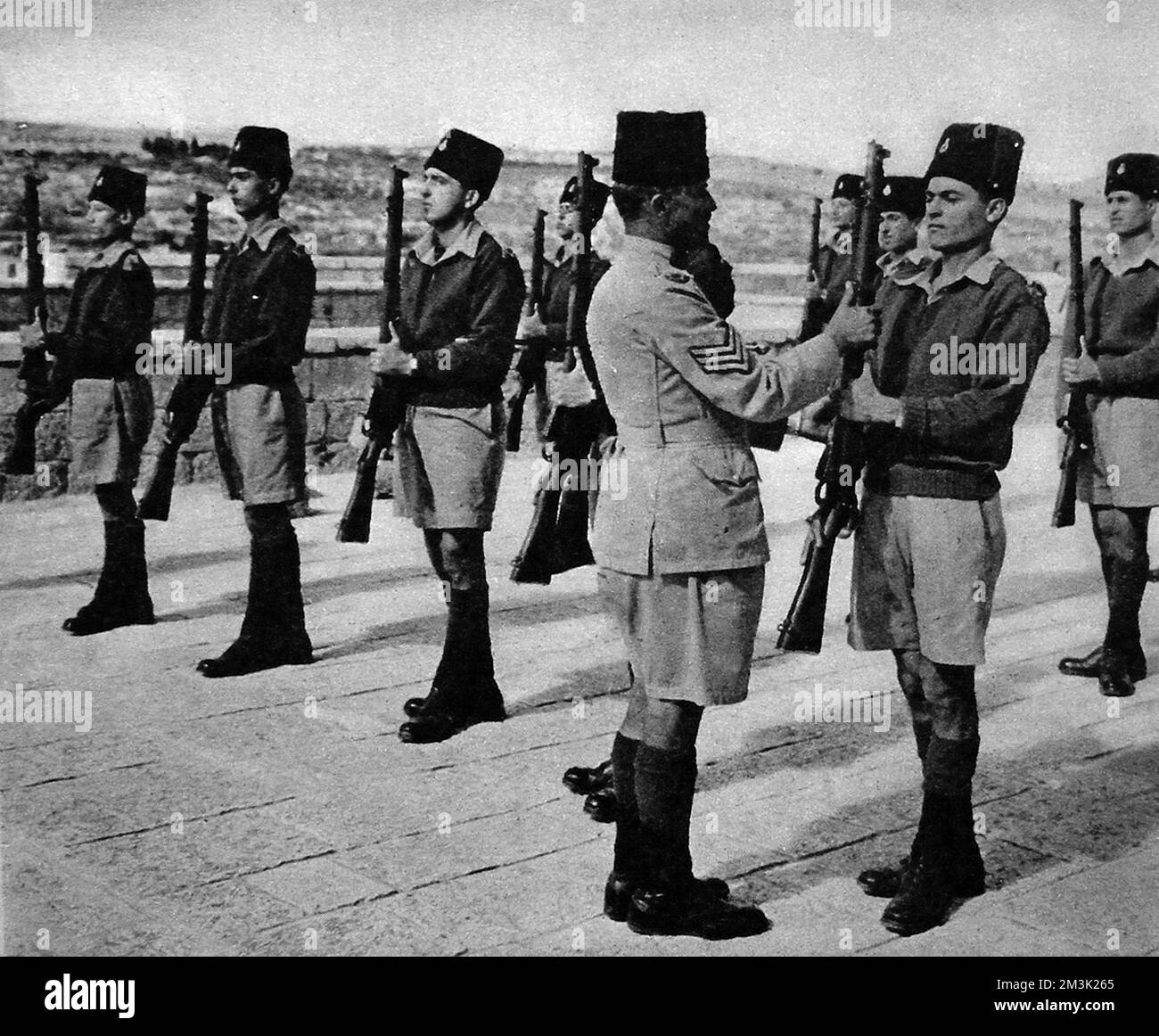 Photograph Showing An Arab Drill Sergeant Centre Instructing Some Recent Recruits To The