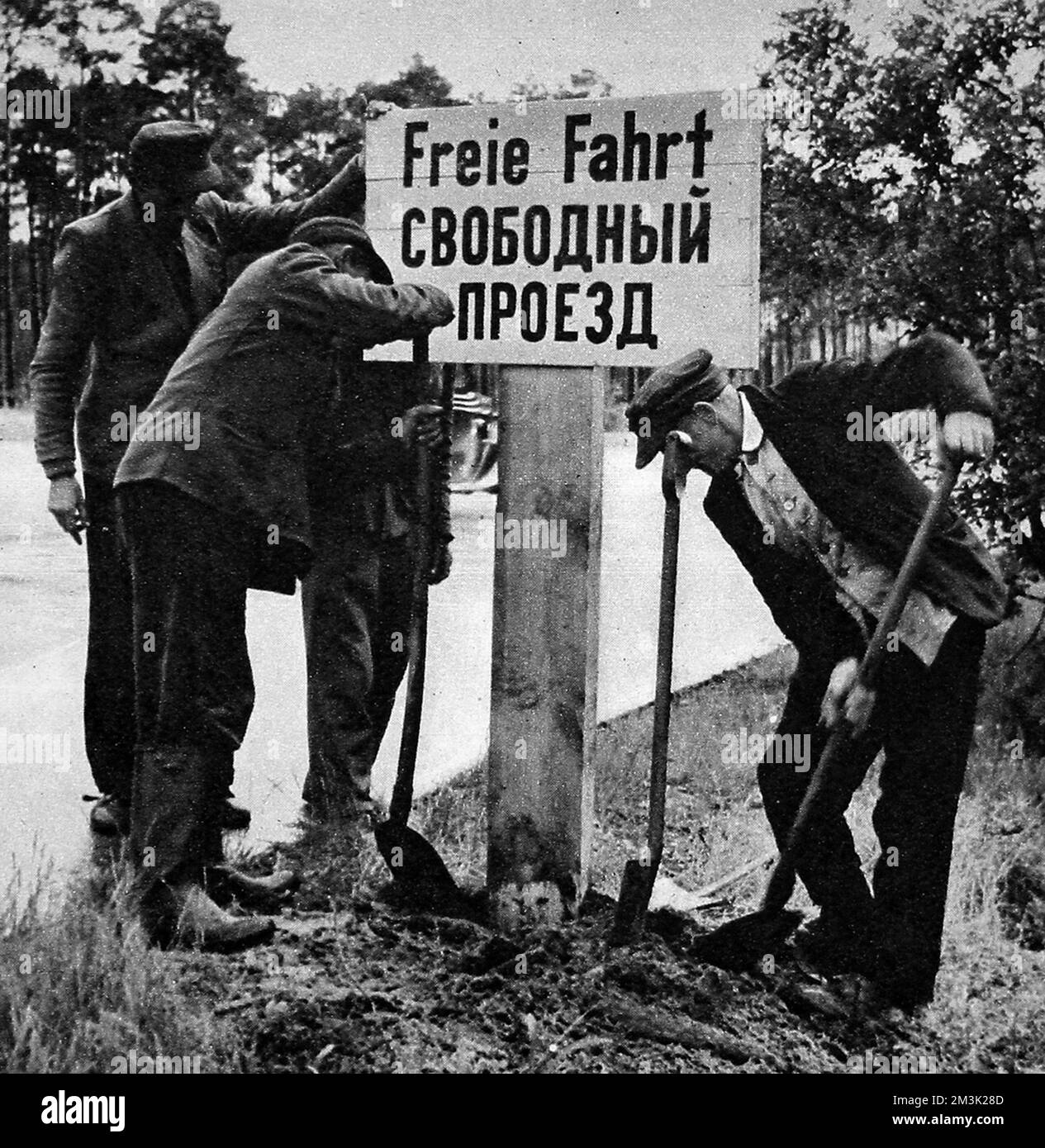 German Workers Re-erecting a 'Free Passage' Sign, Berlin, 19 Stock ...