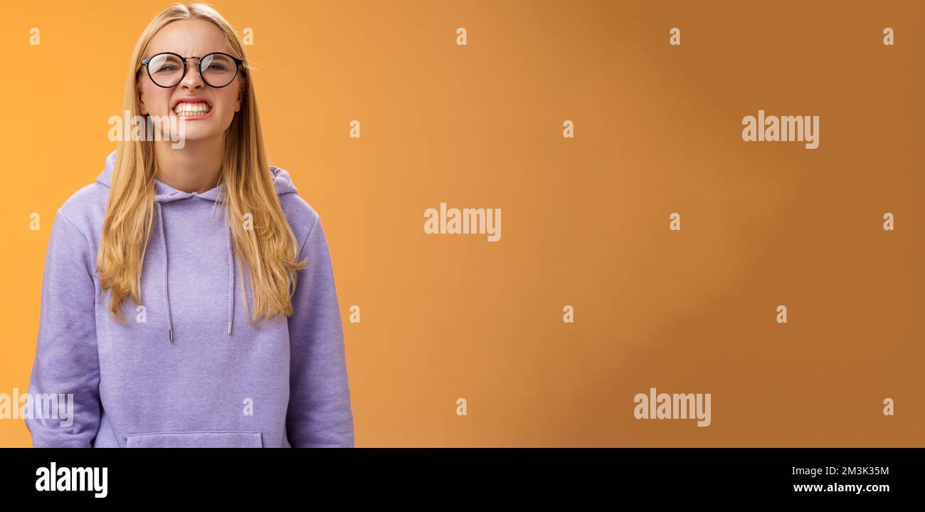 Blond girl show teeth warn can stand herself bite, fool around ...