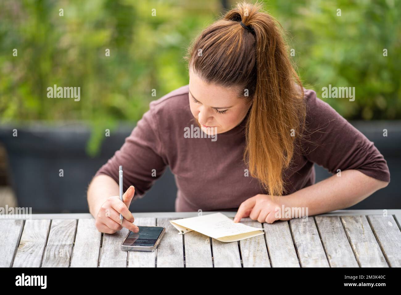 women teacher writing outside. wprking writing notes in a school Stock ...