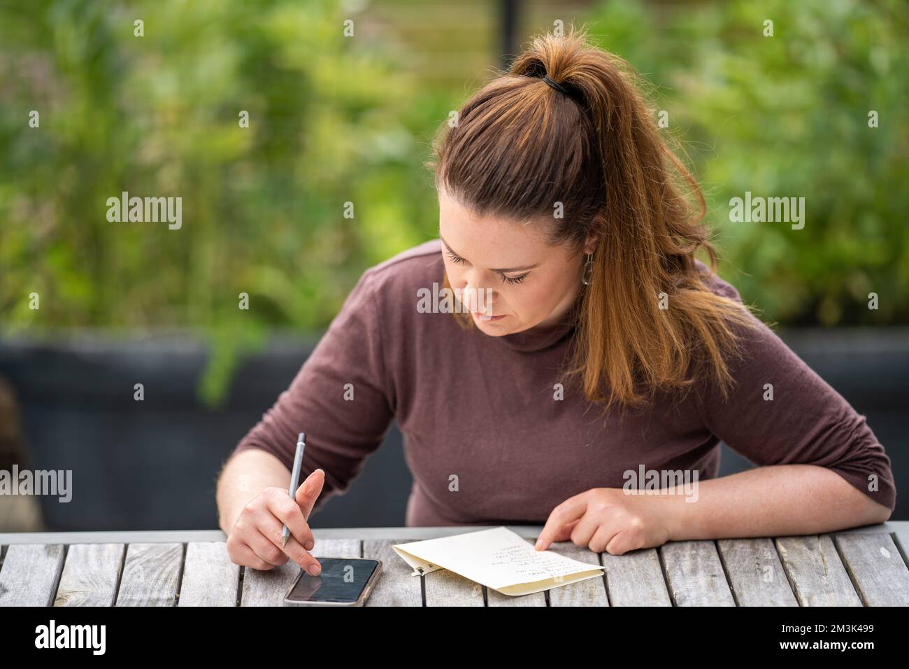 women teacher writing outside. wprking writing notes in a school Stock ...
