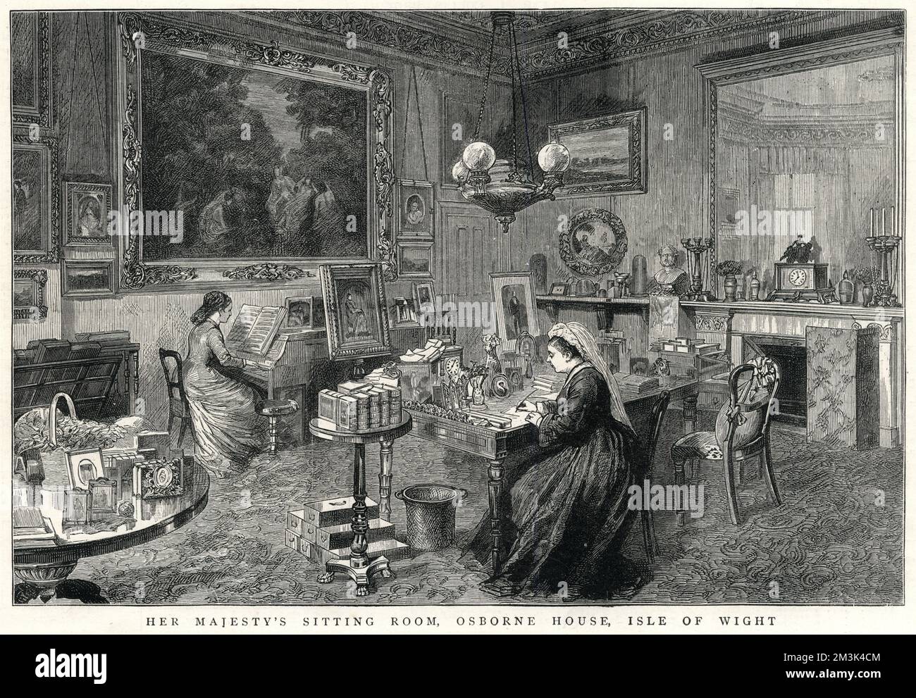 Queen Victoria at her writing desk in a room at Osborne House on the ...