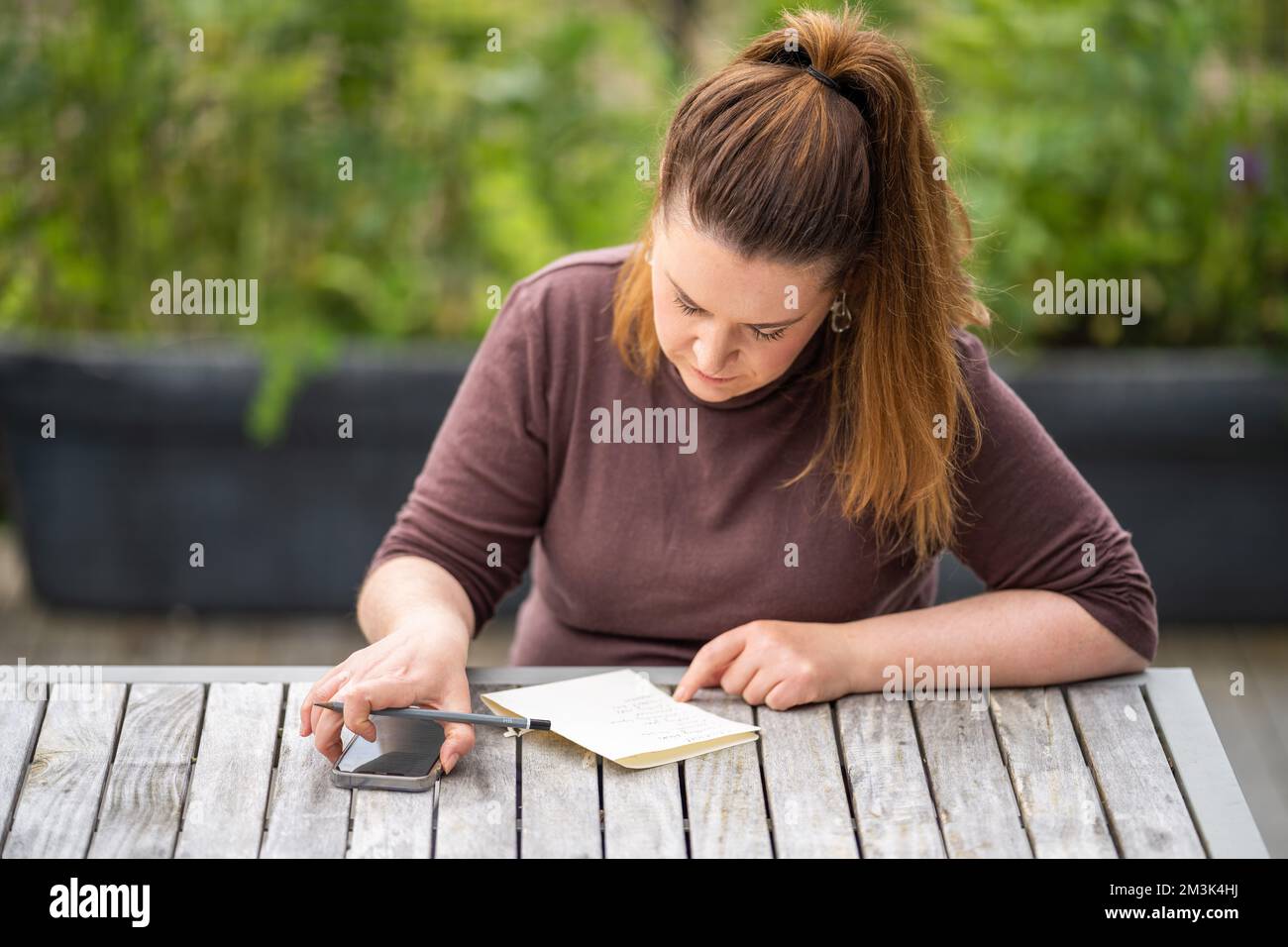 women teacher writing outside. wprking writing notes in a school Stock ...