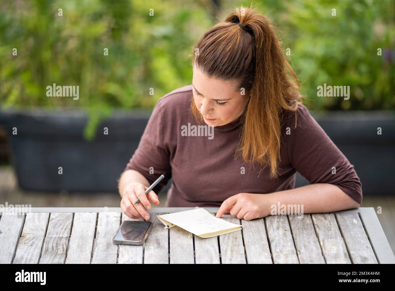 women teacher writing outside. wprking writing notes in a school Stock ...