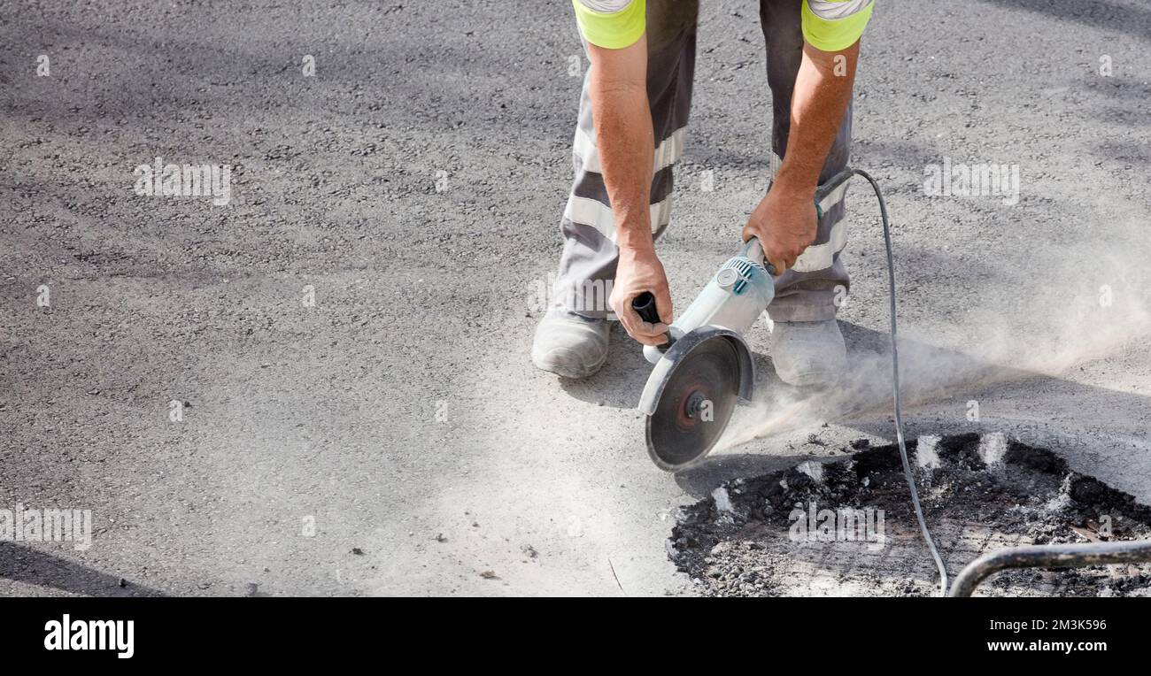 radial with disc for stone in the hands of an operator in uniform ...