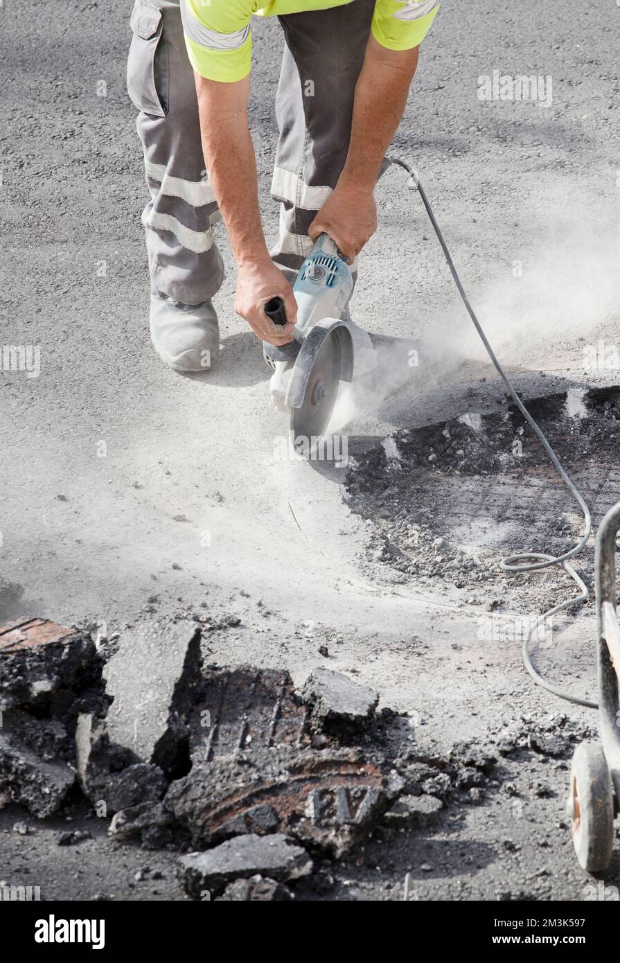 radial with disc for stone in the hands of an operator in uniform ...