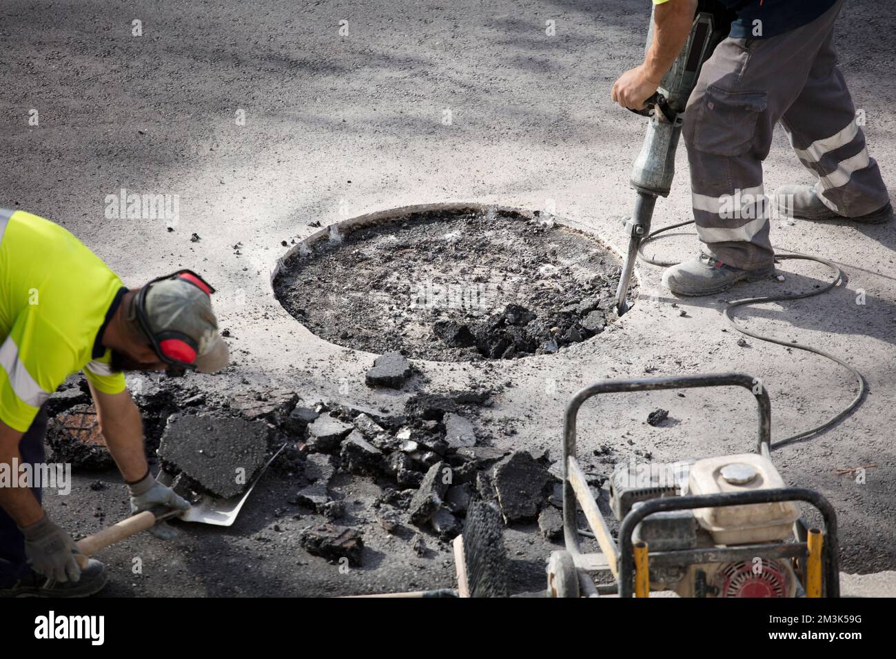 hydraulic hammer in the hands of an operator in uniform works the ...
