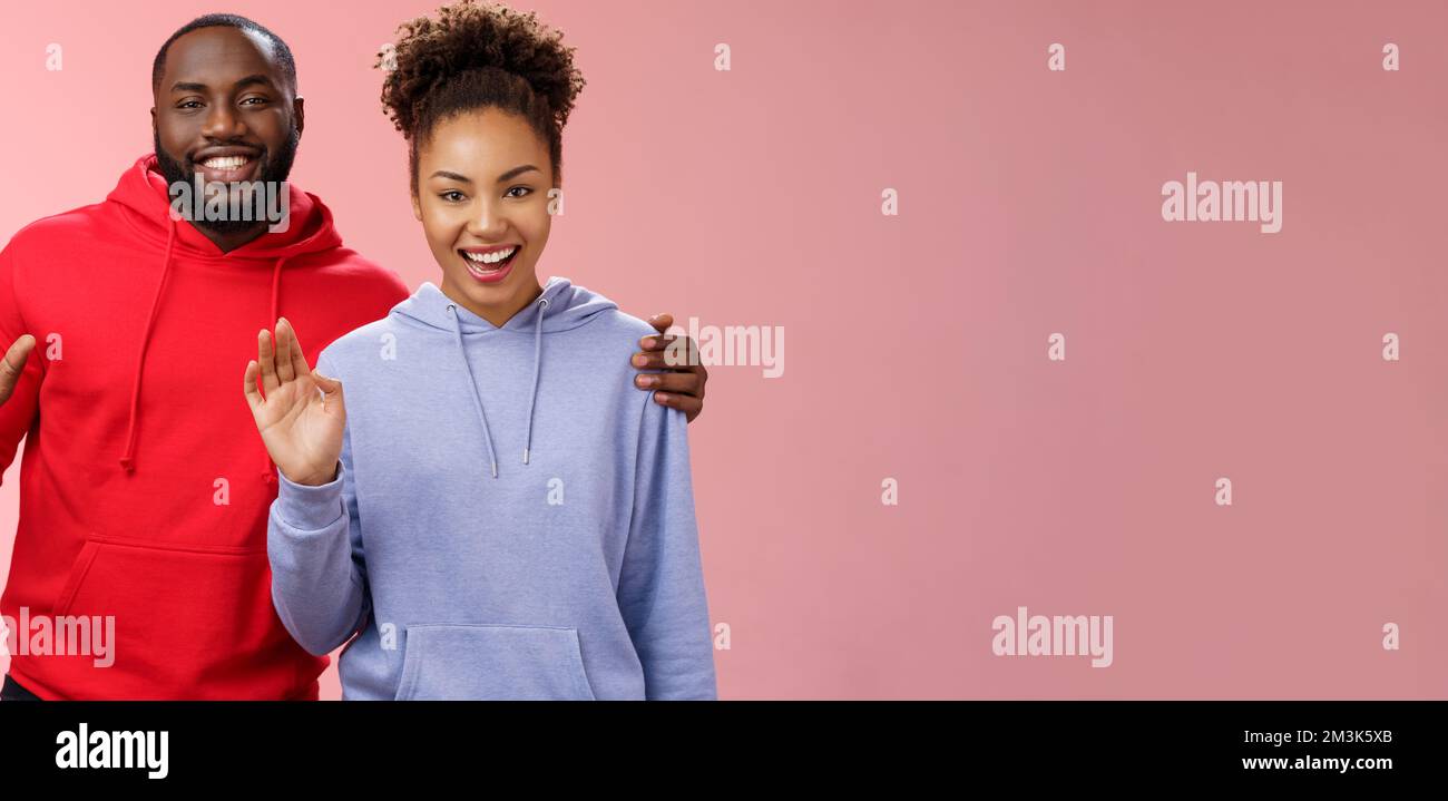 Happy african-american couple man woman hugging friendly guy embracing ...