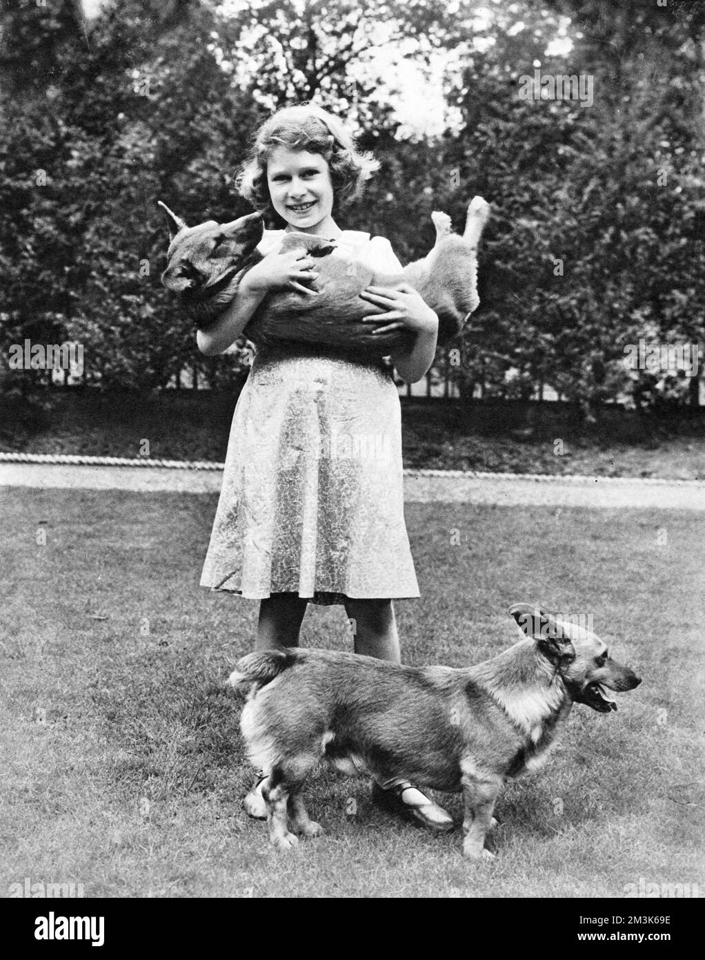 Princess Elizabeth posed with her two Welsh corgis, Jane (Lady Jane, in ...