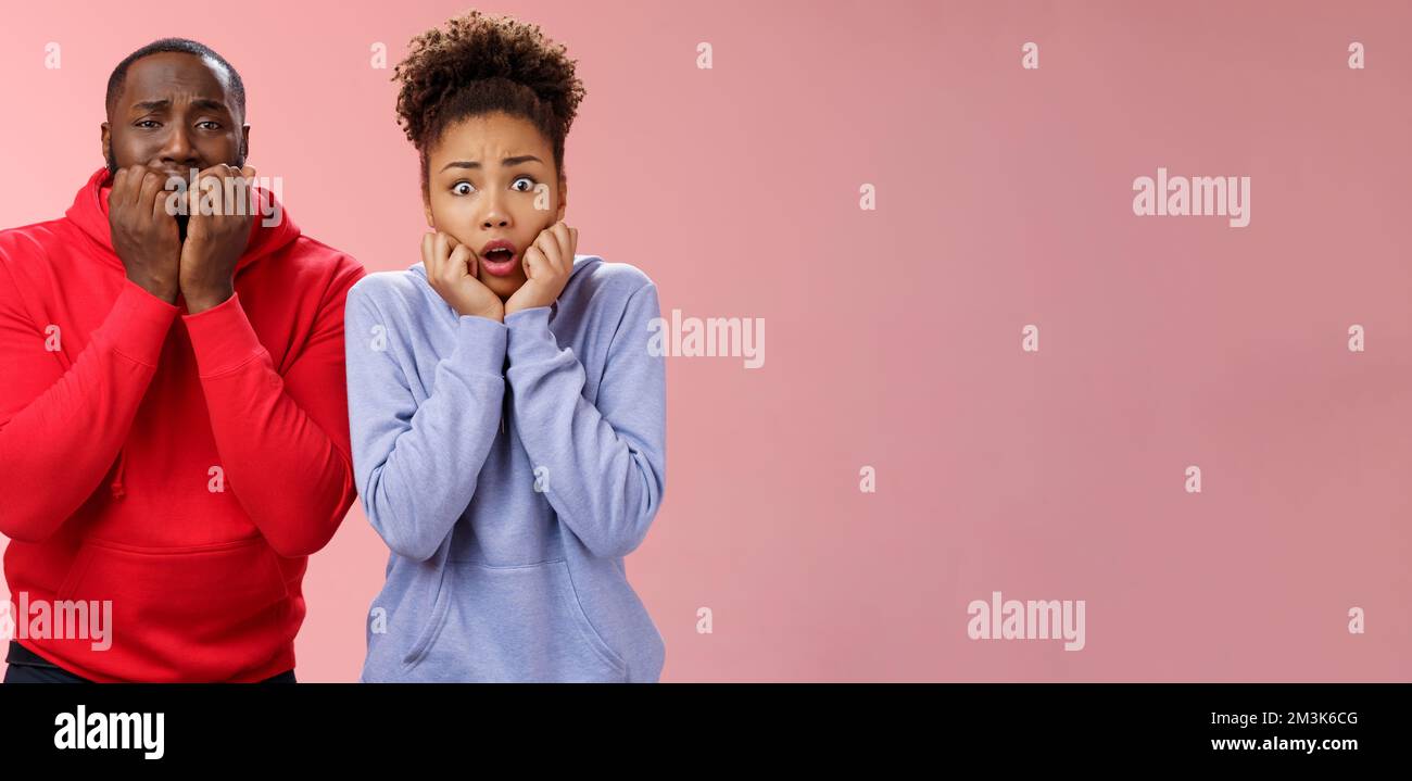 Shocked scared two insecure young african american couple both ...