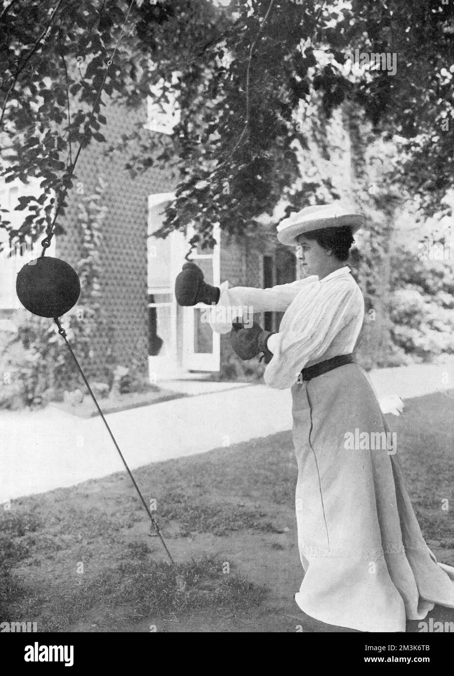 Miss Connie Ediss Punching The Ball Stock Photo - Alamy