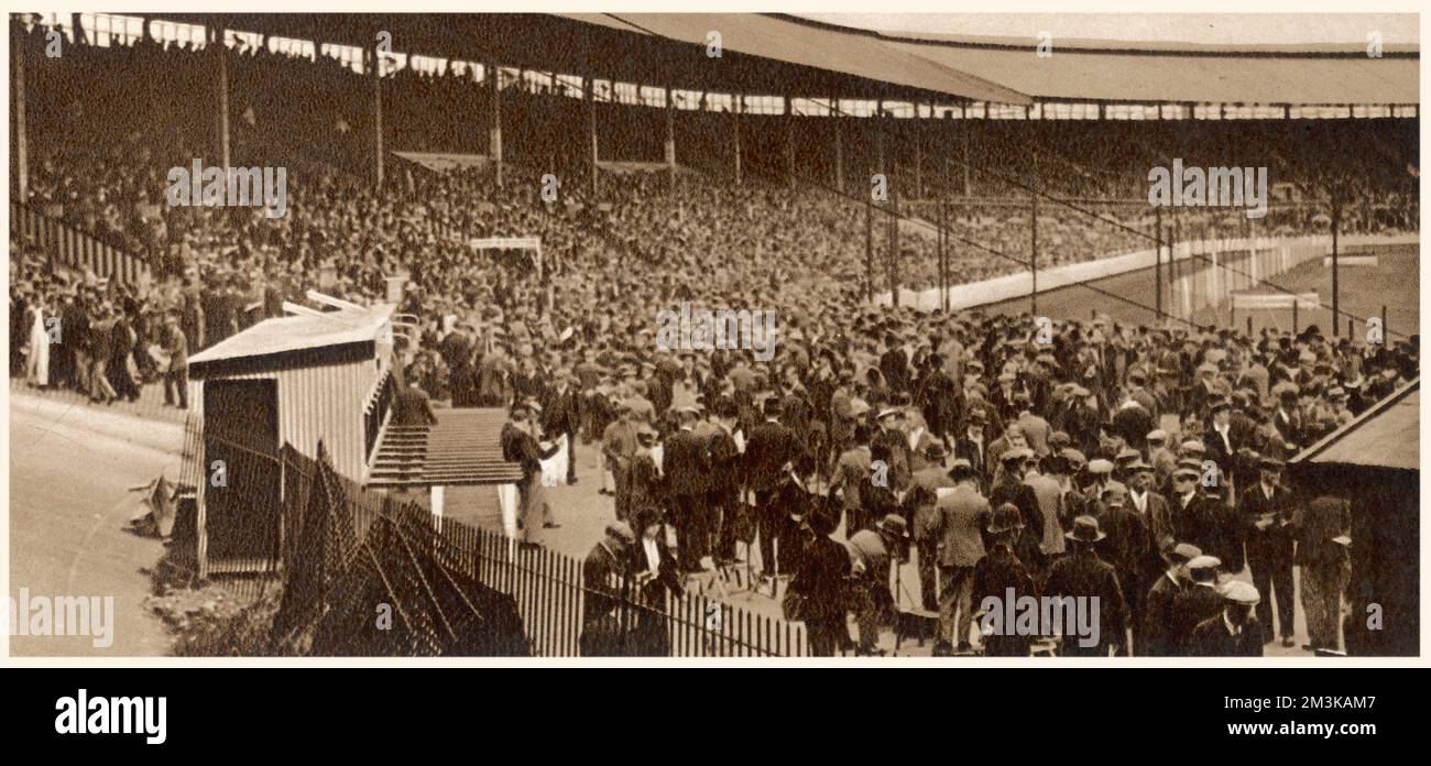 A typical crowd at an unidentified greyhound stadium in London in 1936 ...