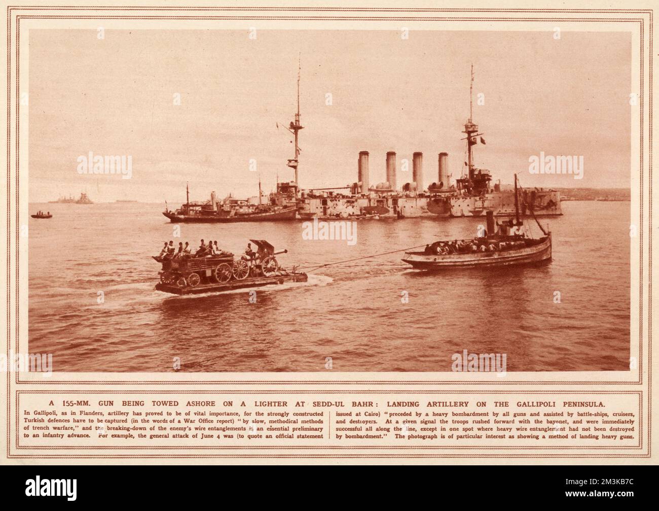 A 155-MM. gun being towed ashore on a lighter at Seddul Bahr on the ...