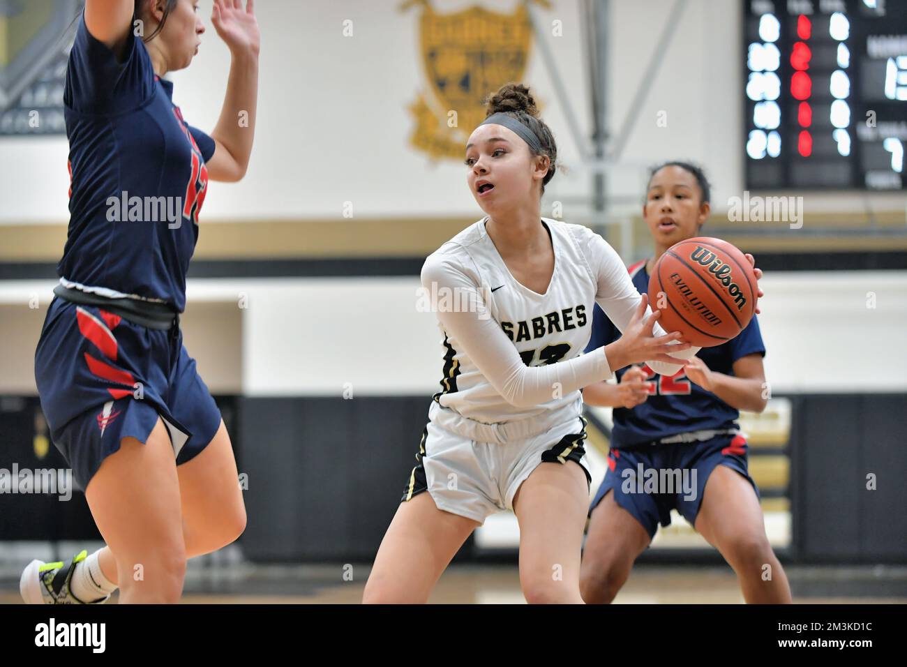 USA. Player working toward the low post while contending with the ...