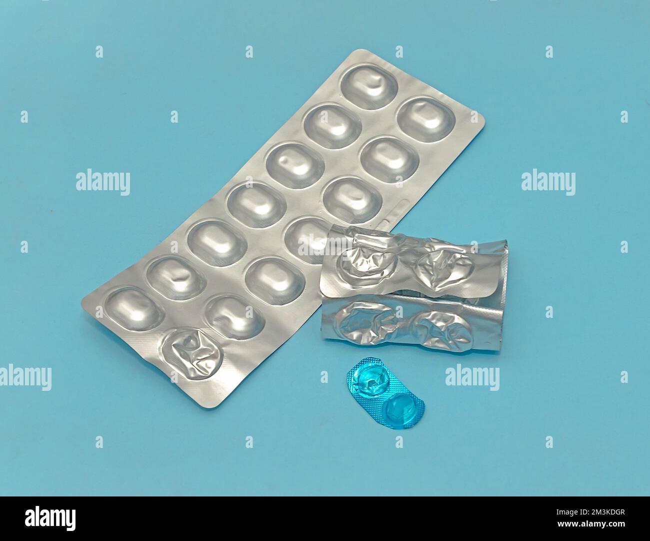 Empty silver blisters from used medicine pills and one new Stock Photo ...