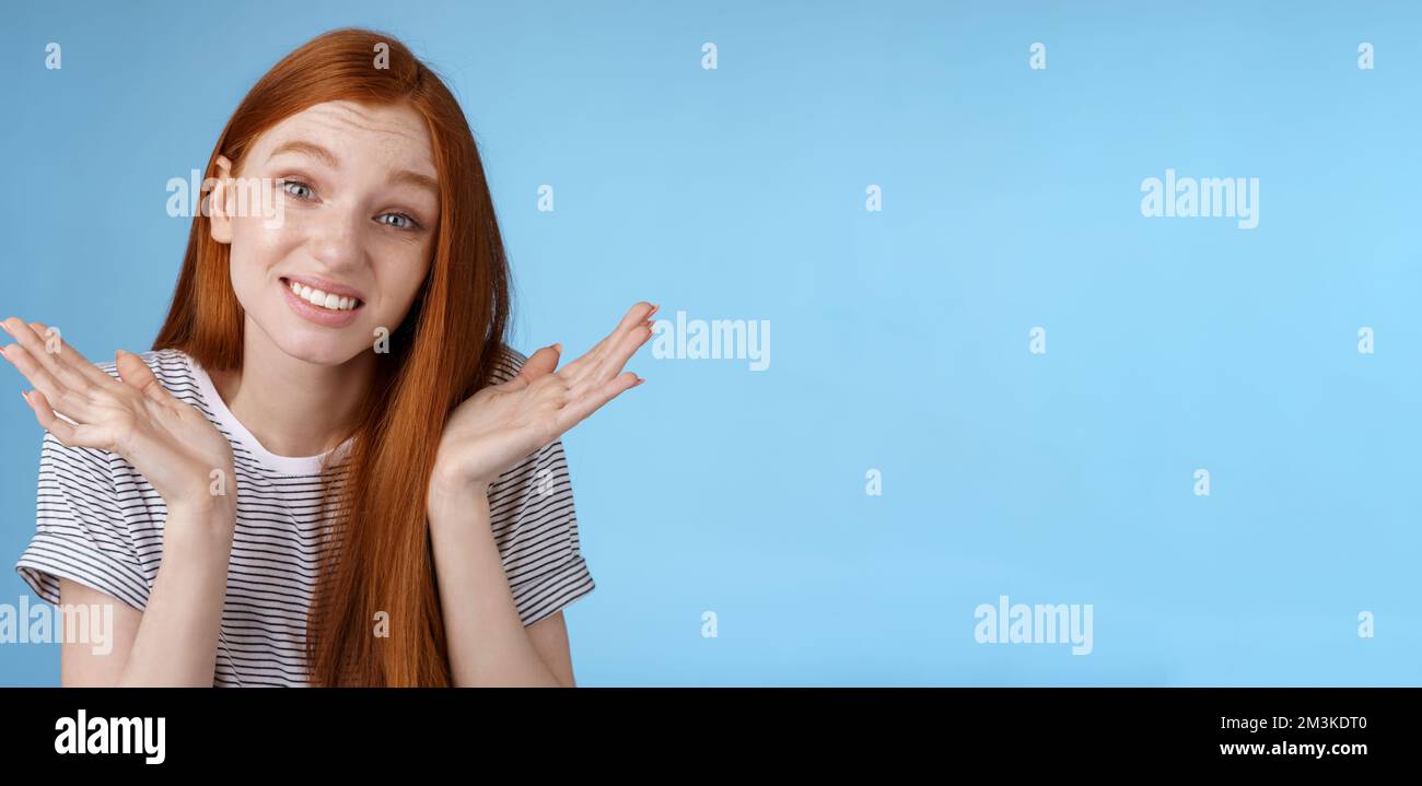 Awkward apologizing cute redhead girlfriend say sorry shrugging spread ...