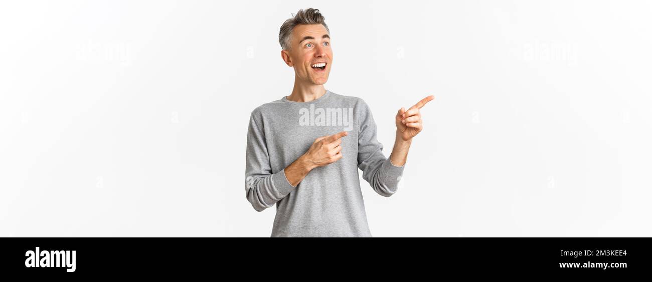 Image of happy and amazed handsome man with grey short hairstyle ...