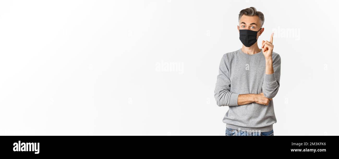 Covid-19, pandemic and social distancing concept. Portrait of handsome ...