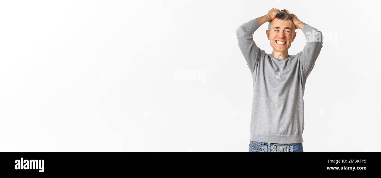 Image of frustrated middle-aged man panicking, losing something ...