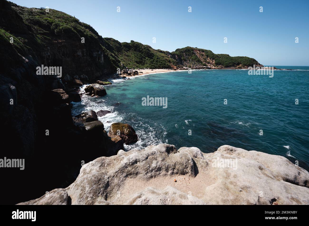 Blue sea, rocky hills. Landscape of the North Coast. A relaxing seaside ...