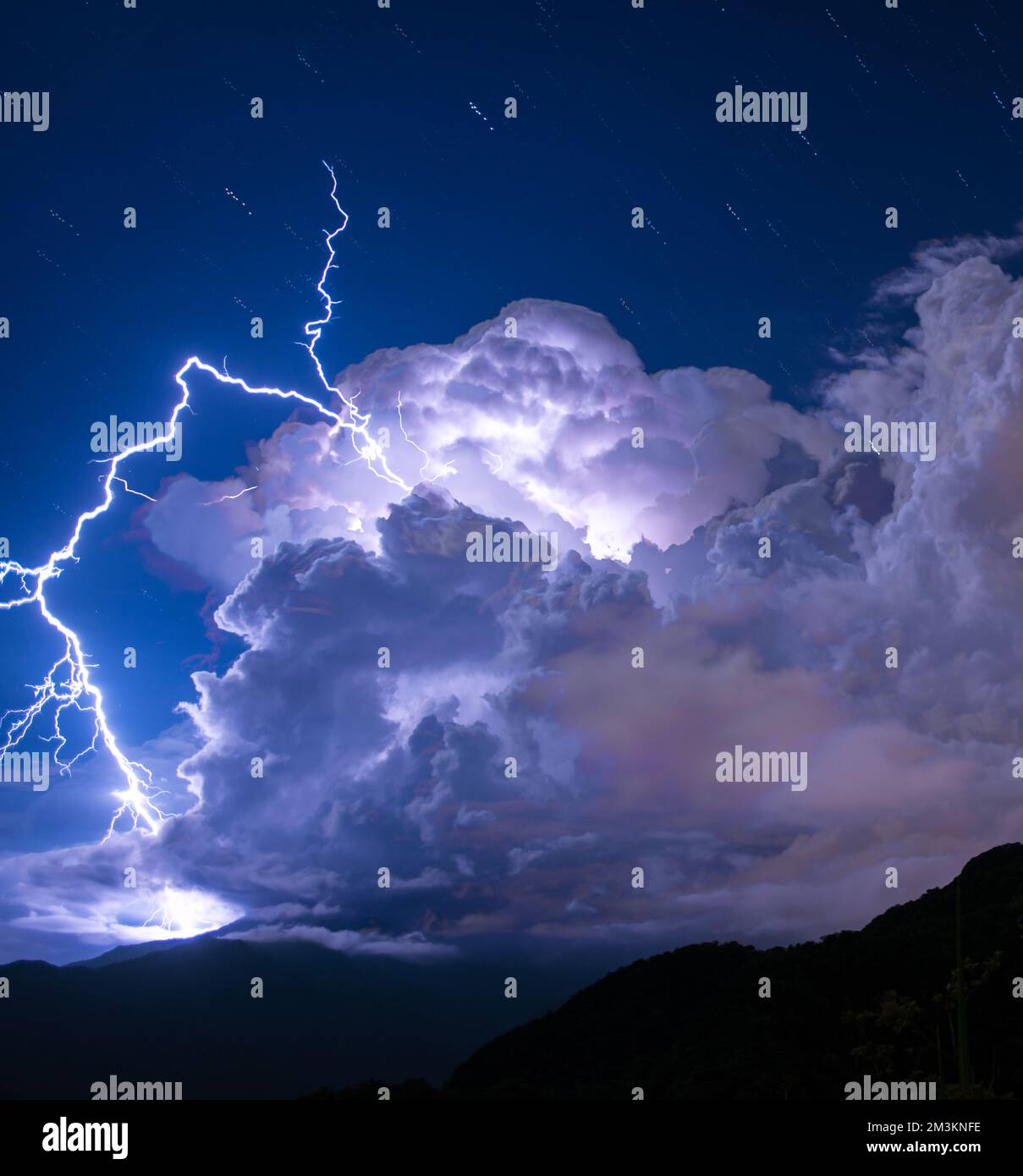 Blue sky, white clouds, lightning and thunder. Huge storm clouds announcing the approach of ...