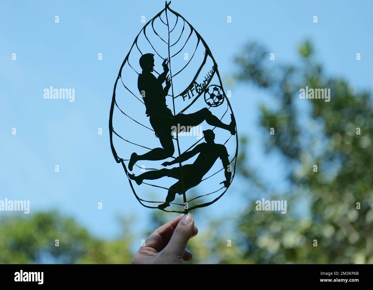 Leaf artist Subham Saha shows his creation depicting players playing ...