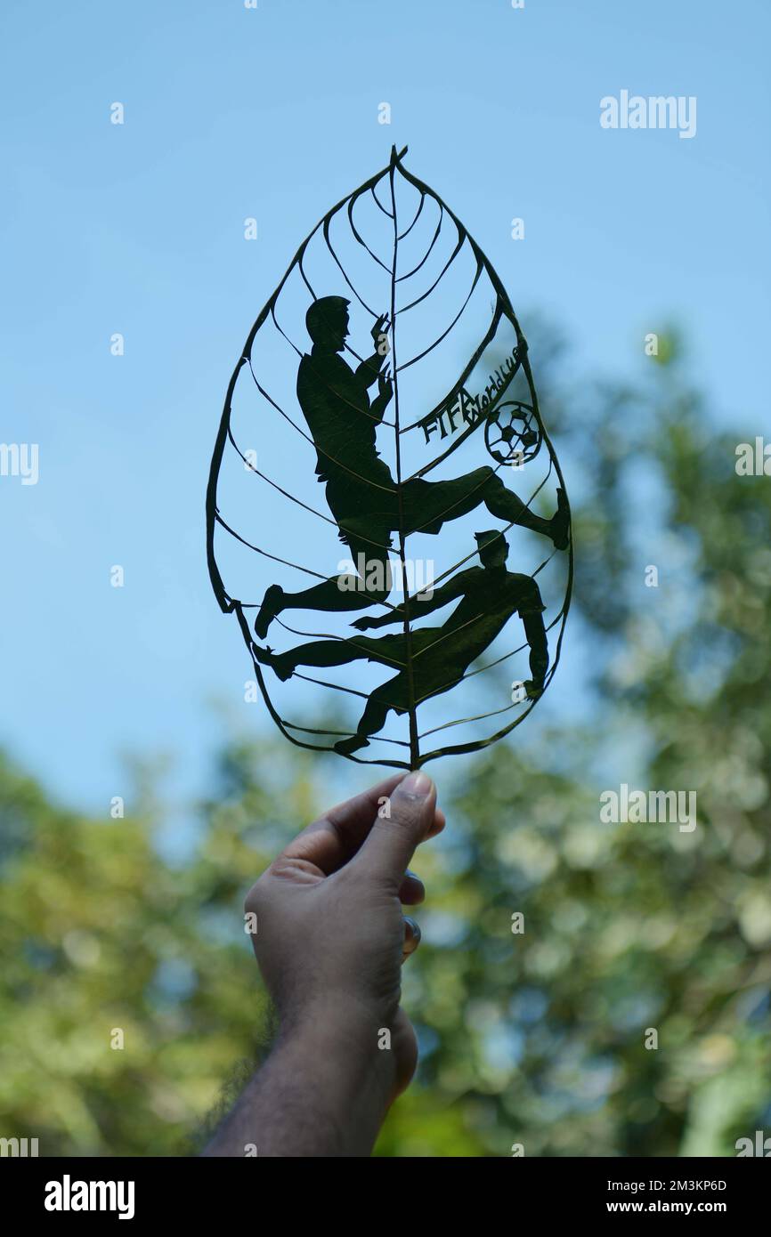 Leaf artist Subham Saha shows his creation depicting players playing ...