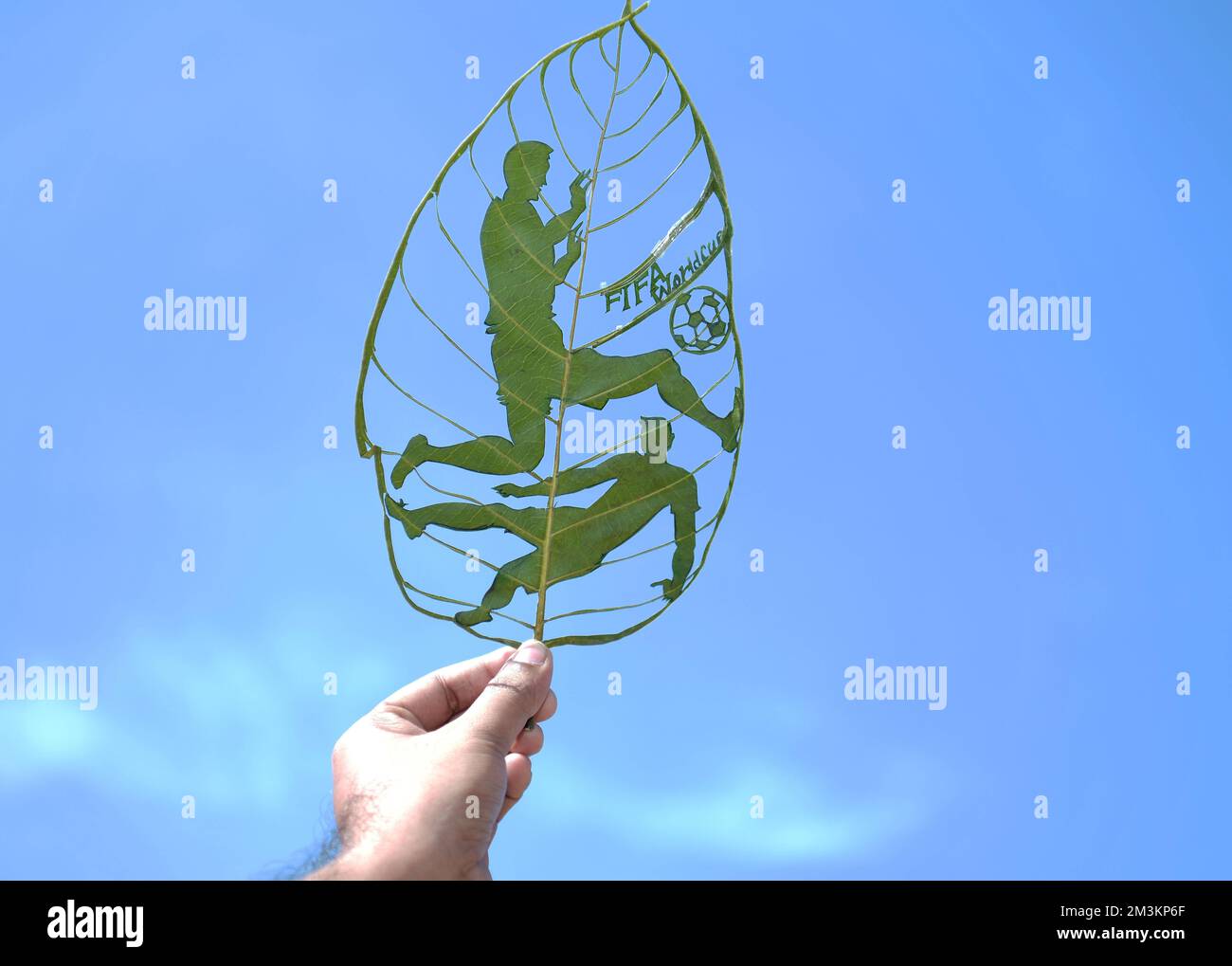 Leaf artist Subham Saha shows his creation depicting players playing ...