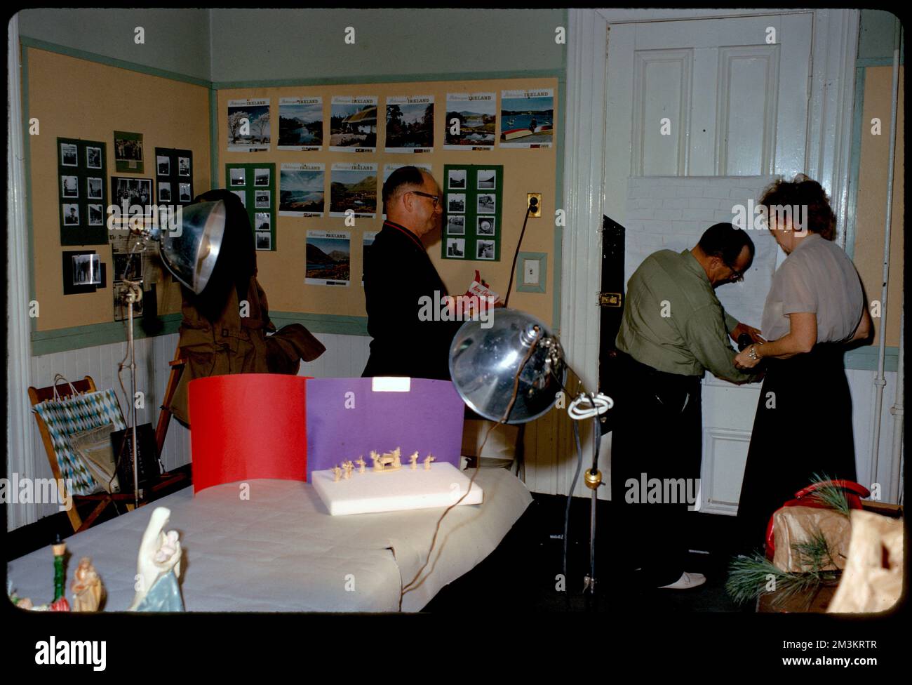 People in room with lighting around angel figurine display , Figurines ...