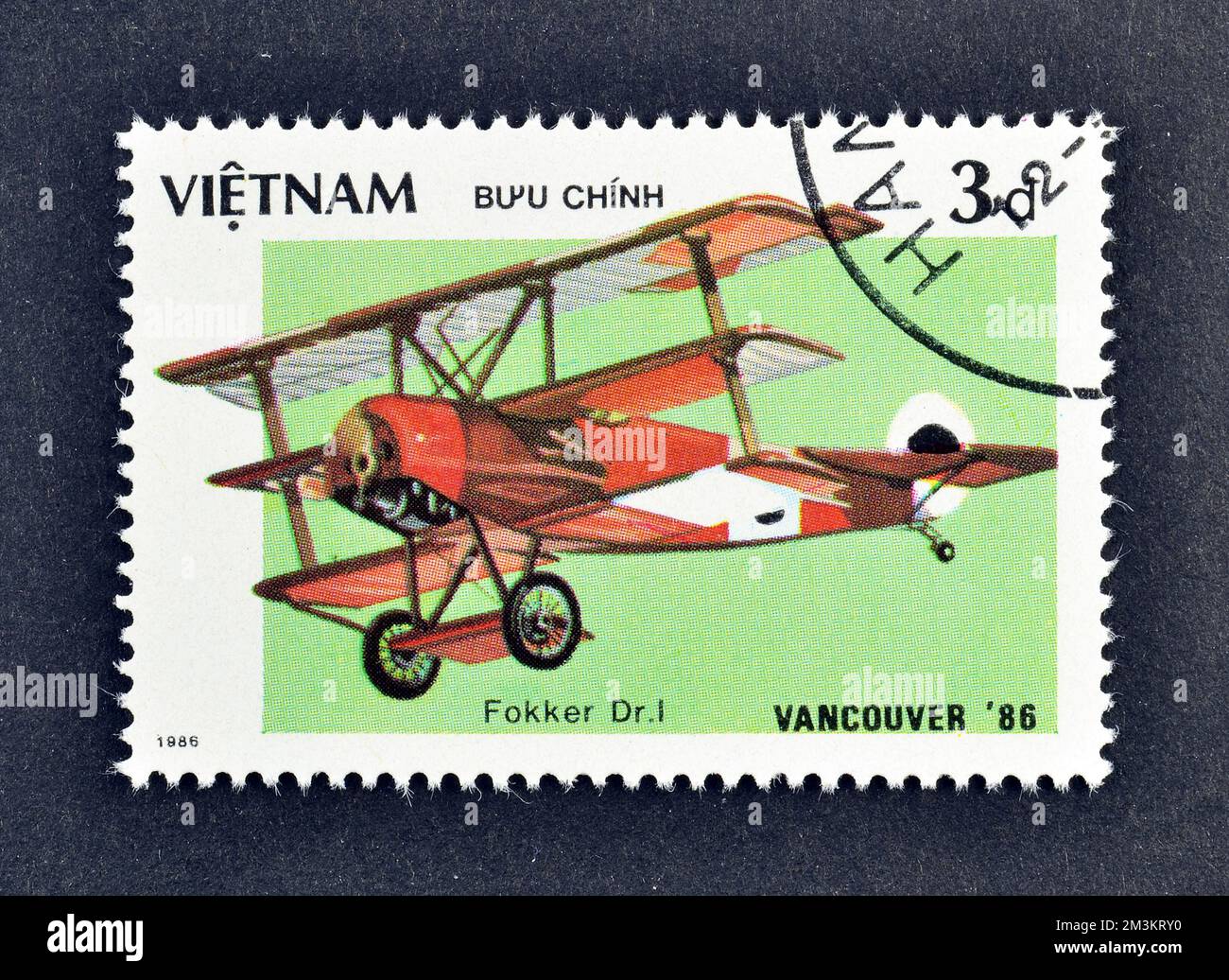 Cancelled postage stamp printed by Vietnam, that shows Fokker Dr-1 ...