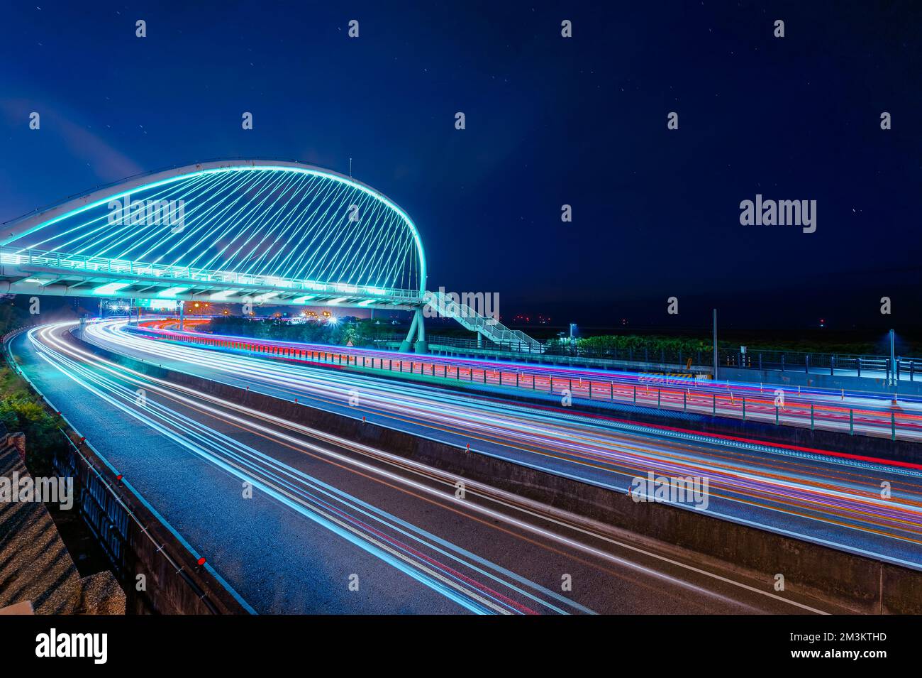 Beautiful and romantic colorful car light track. Night view of white ...