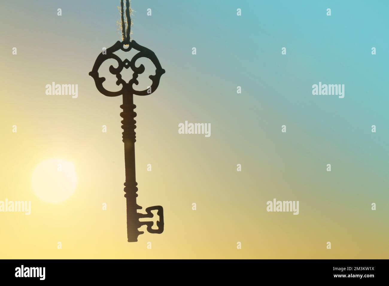 Key on a blurred gradient yellow blue background.Riddle and answer ...