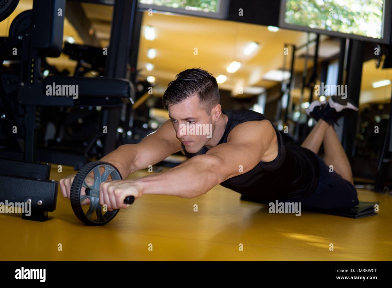A muscular Caucasian man doing exercises in gym Stock Photo - Alamy
